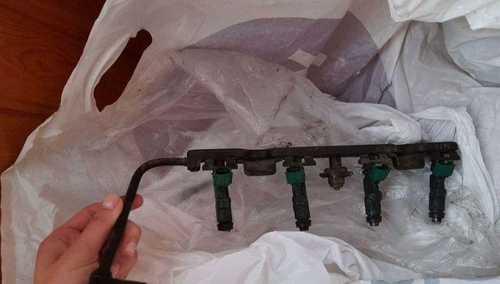 Топливная рейка 23250-21020 toyota 1 nz fe