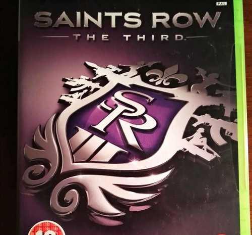 Сен бу. Saints Row the third Xbox 360. Saints Row 3 the third Xbox 360. Saints Row 3 обложка. Saints Row the third обложка.