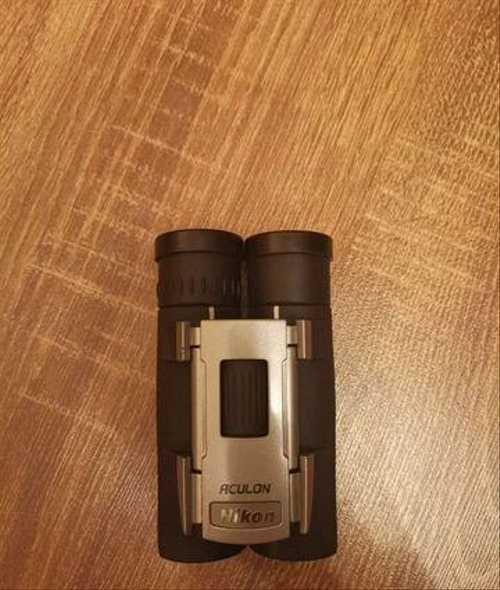 Бинокль Nikon Aculon A30 10x25 серебристый