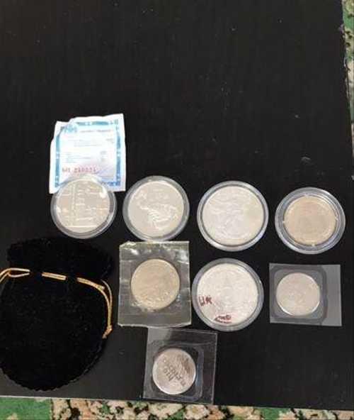 Серебряные монеты в банковской упаковке