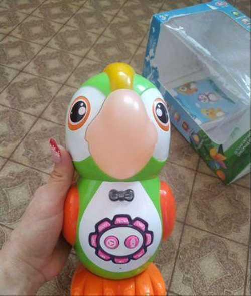 Игрушка говорящий попугай