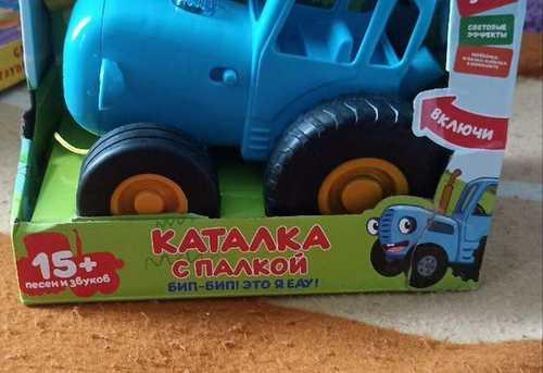 Игрушка каталка синий трактор