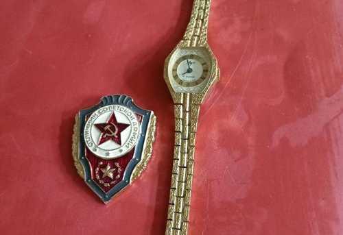 Часы "луч" и значек времен СССР