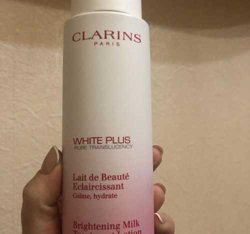 Clarins осветляющее молочко для лица