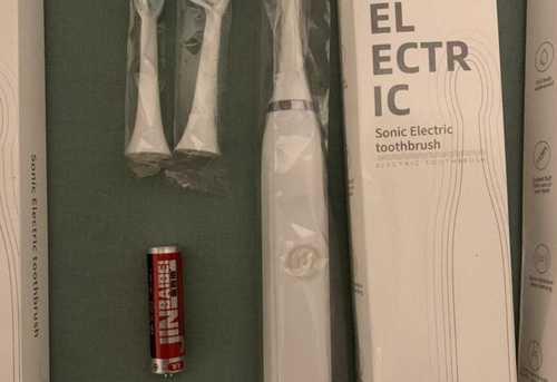 Электрическая зубная щетка
