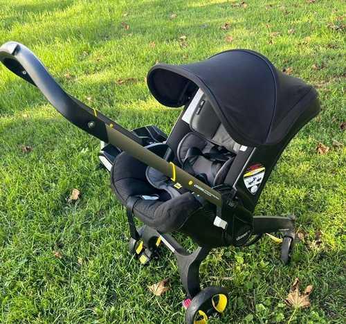 Детская коляска -автокресло Doona с базой Isofix