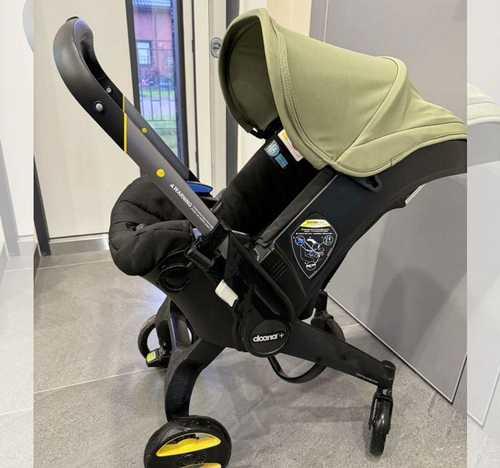 Коляска автокресло doona с базой isofix