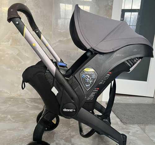Автолюлька Doona  с базой Izofix