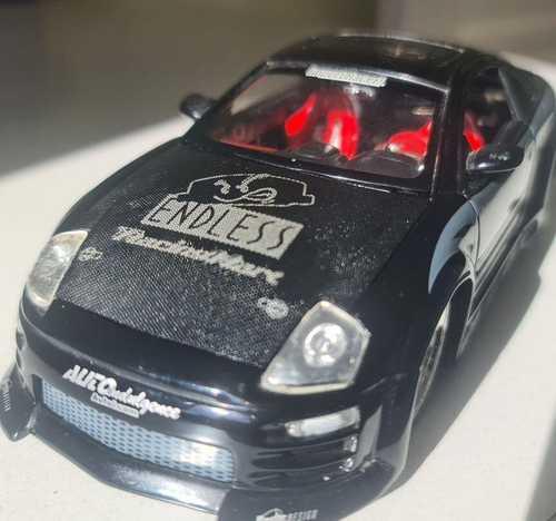 Модель Mitsubishi Eclipse 2003 масштаб 1:24