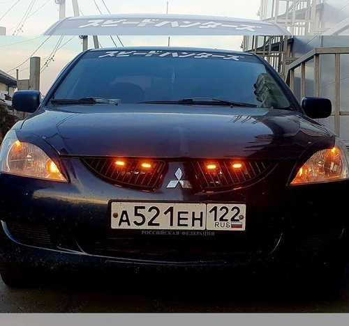 Ходовые огни дхо в решетку Mitsubishi Lancer