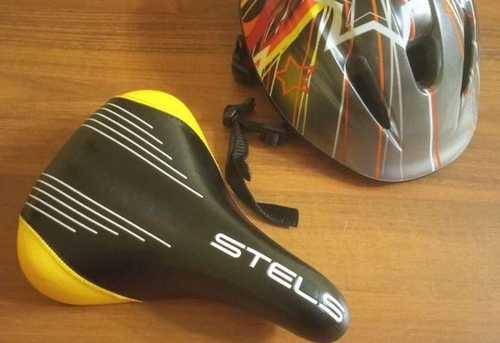 Шлем защитный и сиденье велосипедное