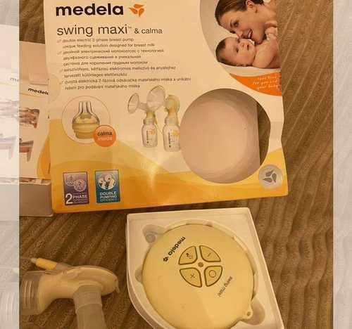 Молокоотсос medela электрический