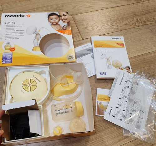 Молокоотсос medela swing электрический