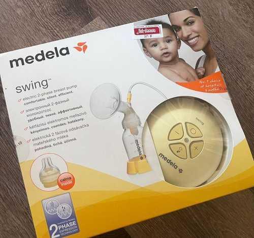 Молокоотсос Medela Swing электрич. и пакеты