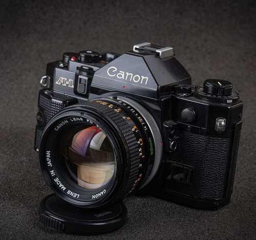 Пленочный фотоаппарат Canon A-1 и объектив FD 50/1