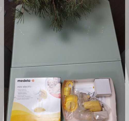 Молокоотсос medela электрический