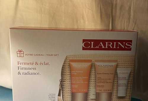 Clarins набор кремов и косметичка