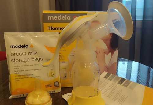 Молокоотсос medela ручной +calma+пакеты