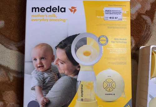 Молокоотсос medela swing flex