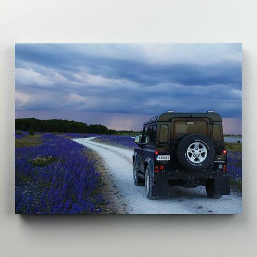 Интерьерная картина на холсте "Черный внедорожник между полями пурпурных цветов - Land Rover Defender" размер 30x22 см