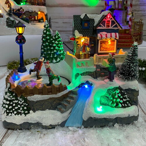 Kaemingk Светящаяся композиция Christmas Village: Зимние забавы на катке 21*16 см, с движением и музыкой, на батарейках 481369